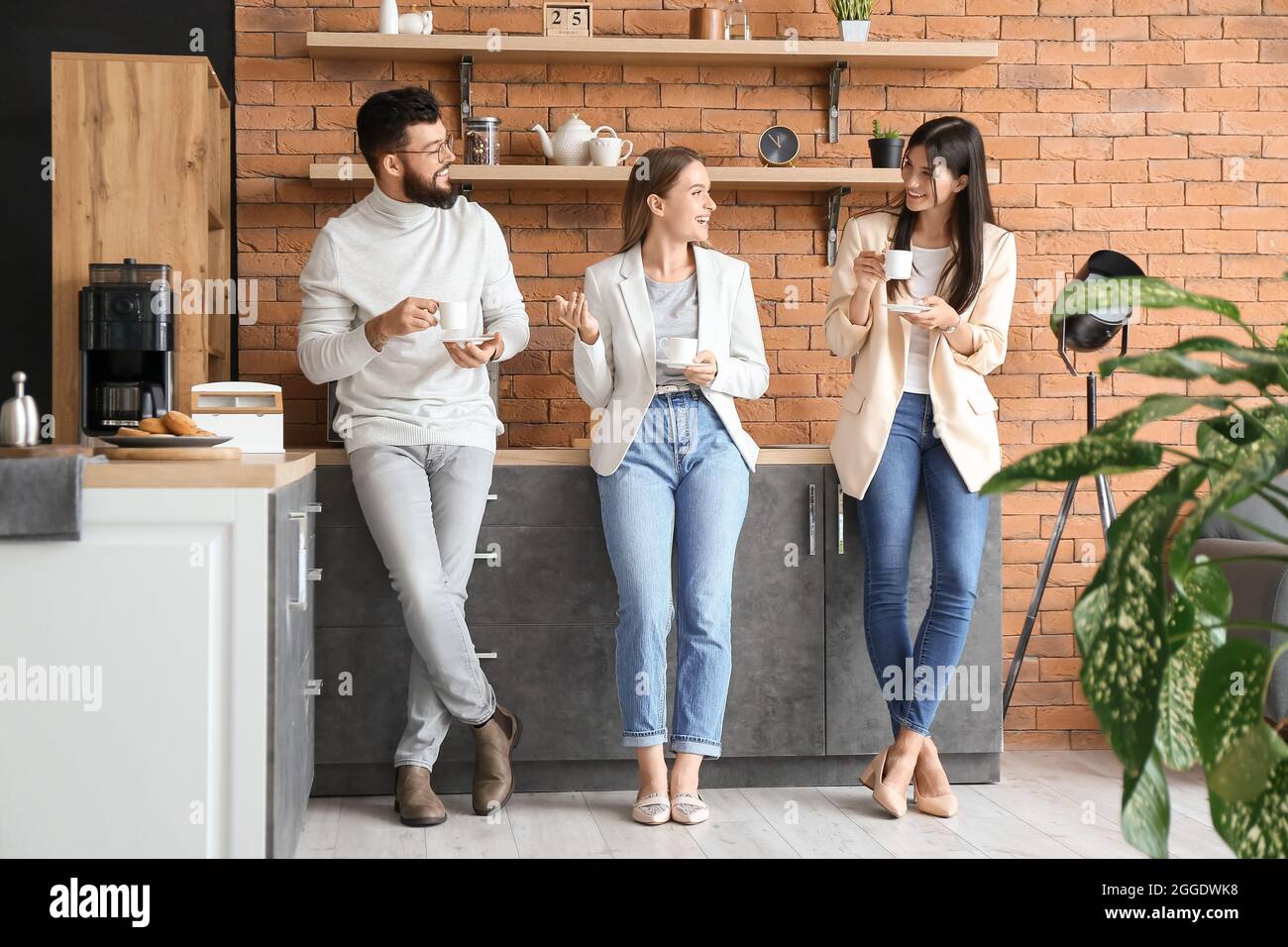 People having coffee break in office Stock Photo - Alamy
