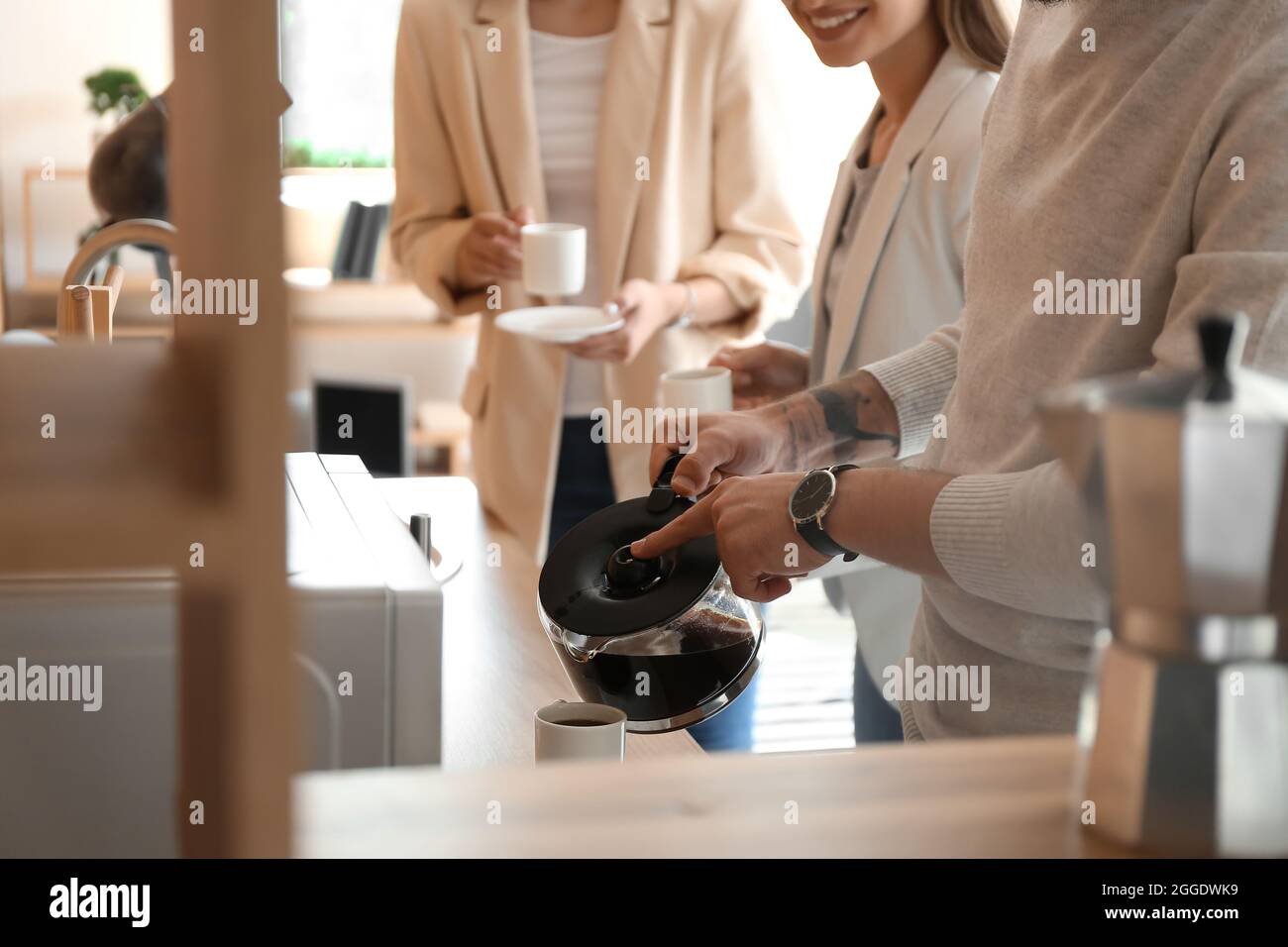 People having coffee break in office Stock Photo - Alamy