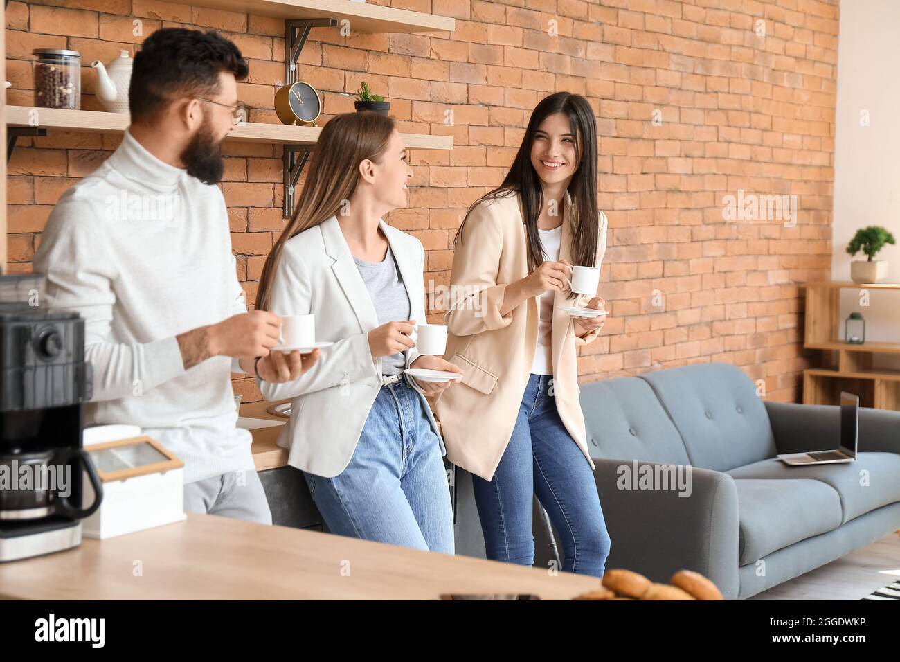 People having coffee break in office Stock Photo - Alamy