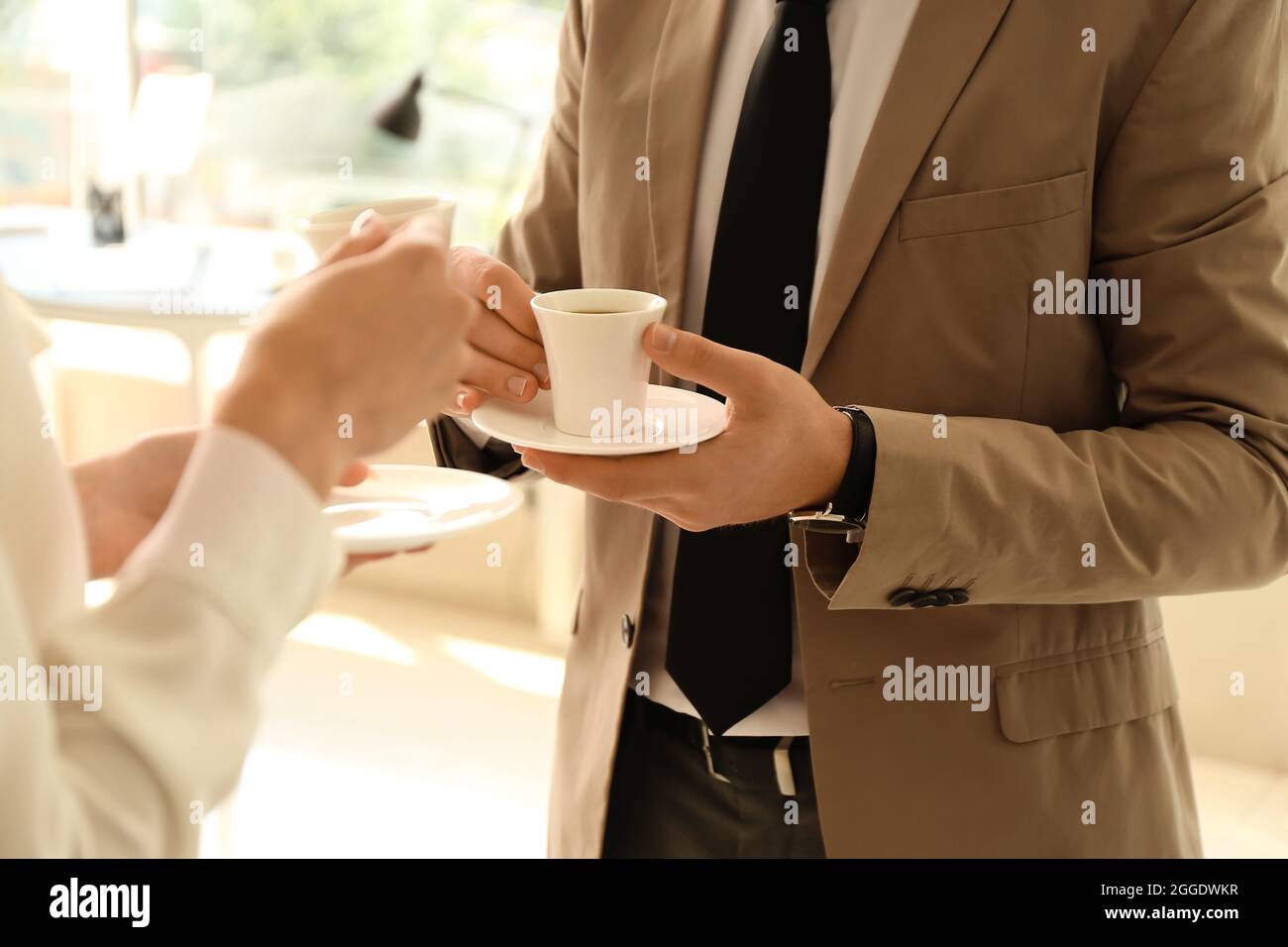 Business people having coffee break in office Stock Photo - Alamy