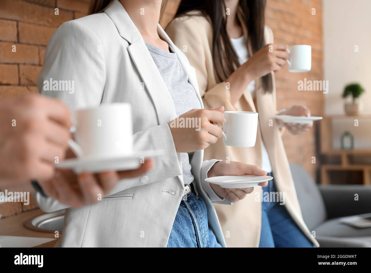 People having coffee break in office Stock Photo - Alamy