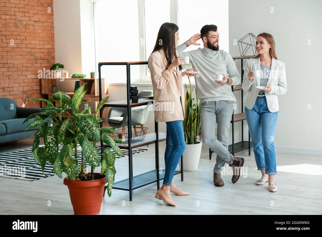 People having coffee break in office Stock Photo - Alamy