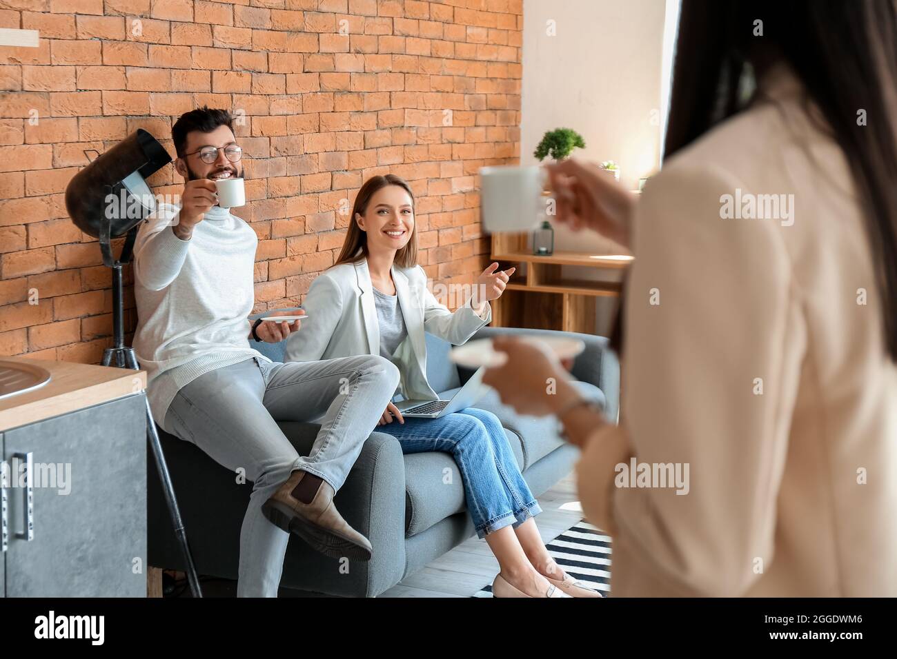 People having coffee break in office Stock Photo - Alamy