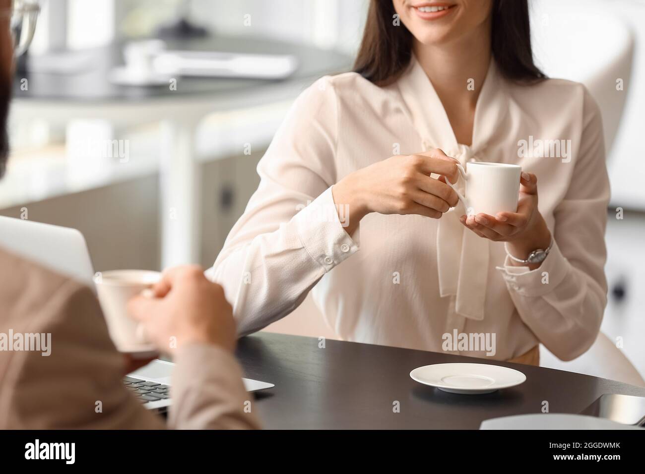 Business people having coffee break in office Stock Photo - Alamy