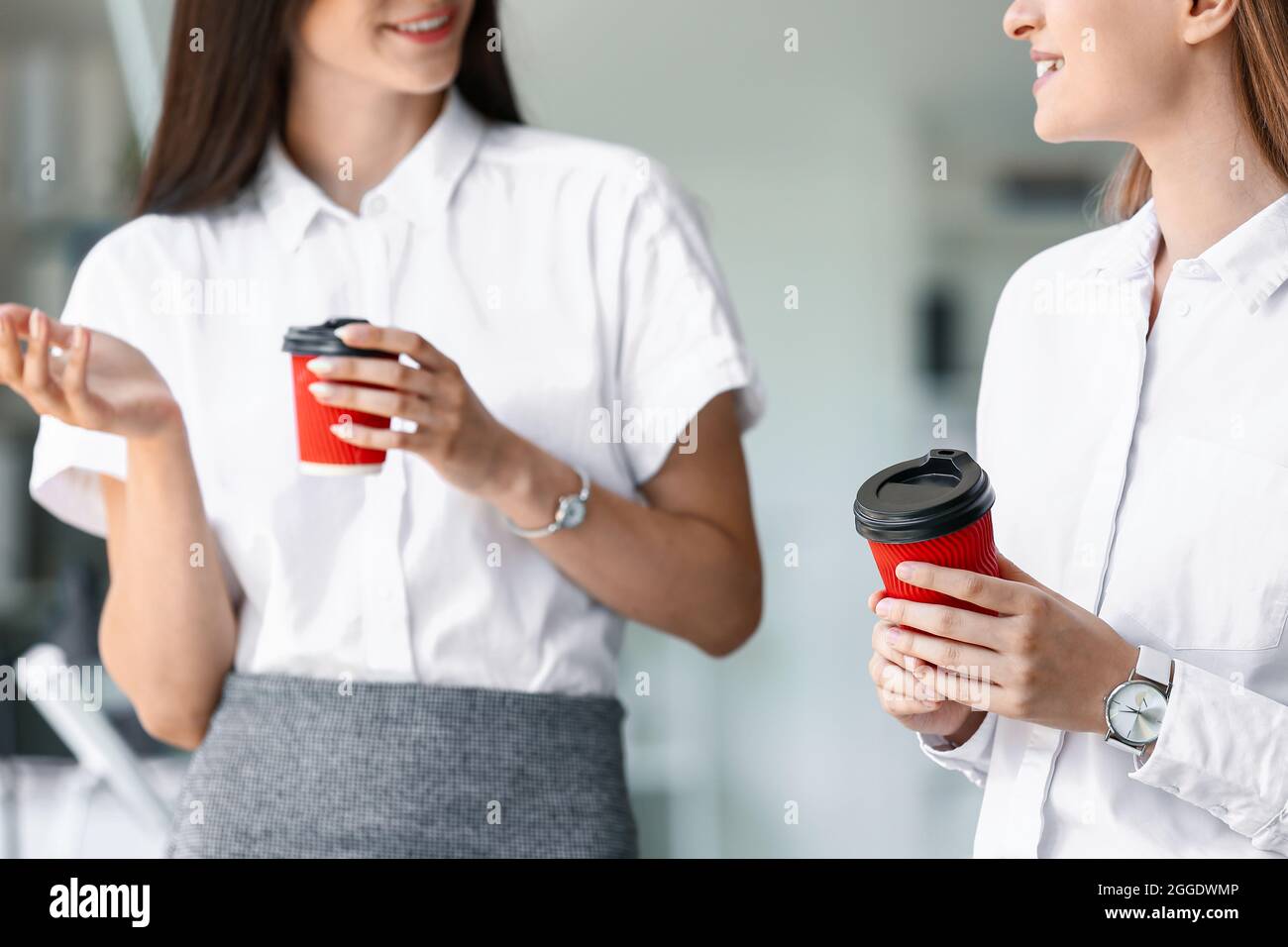 Business people having coffee break in office Stock Photo - Alamy