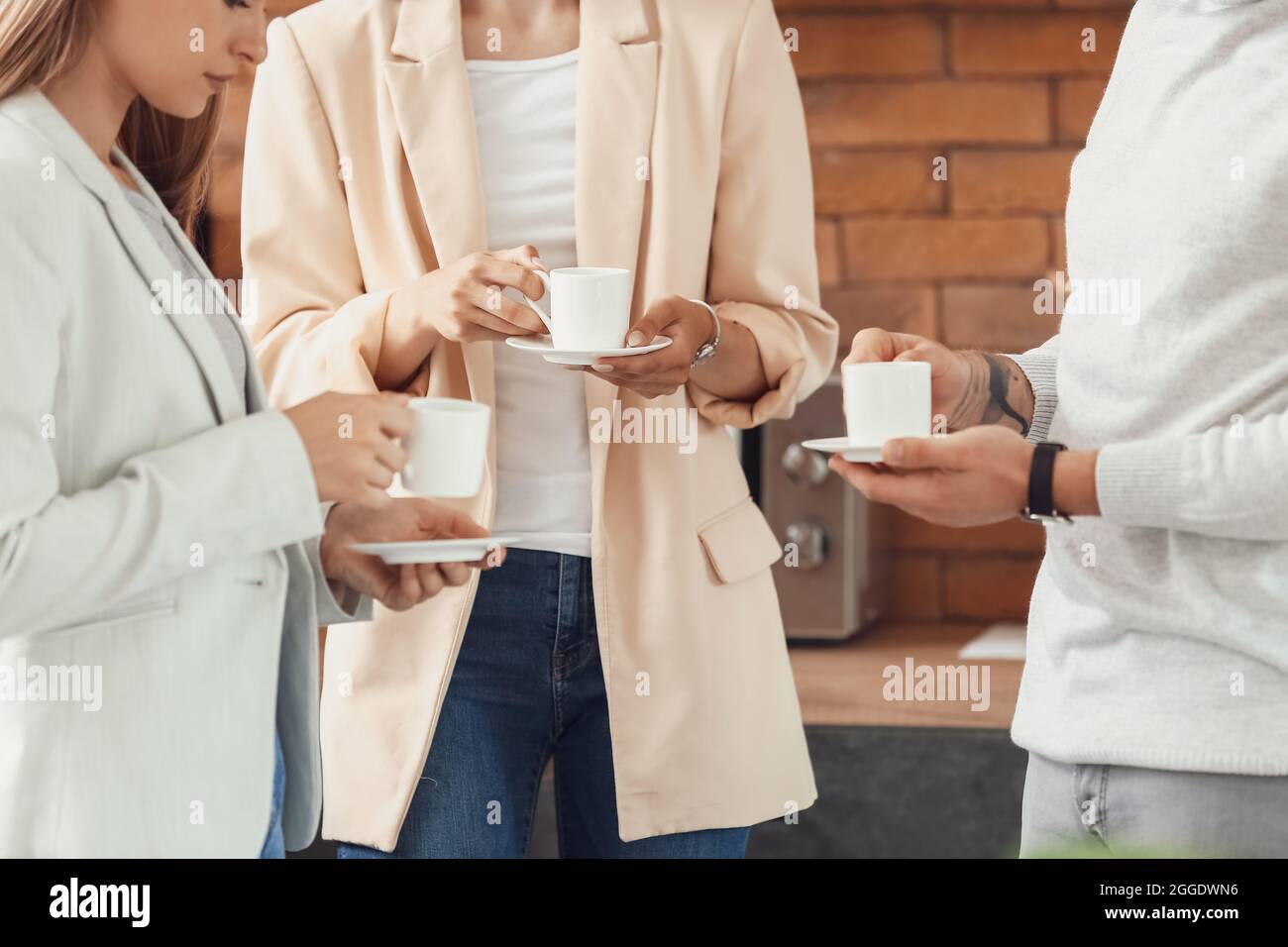 People having coffee break in office Stock Photo - Alamy