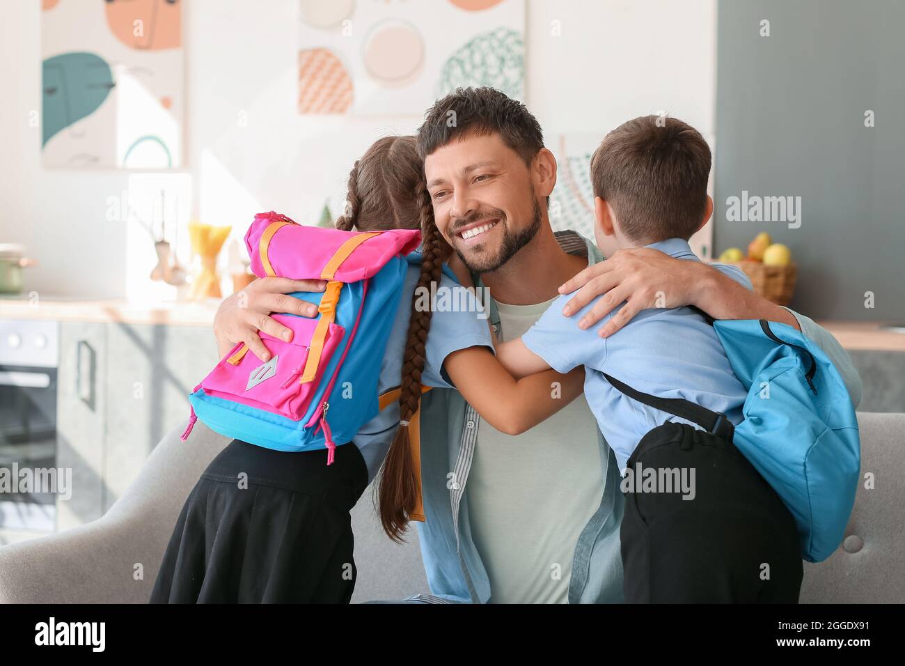 Father saying goodbye to his little children before school Stock Photo ...