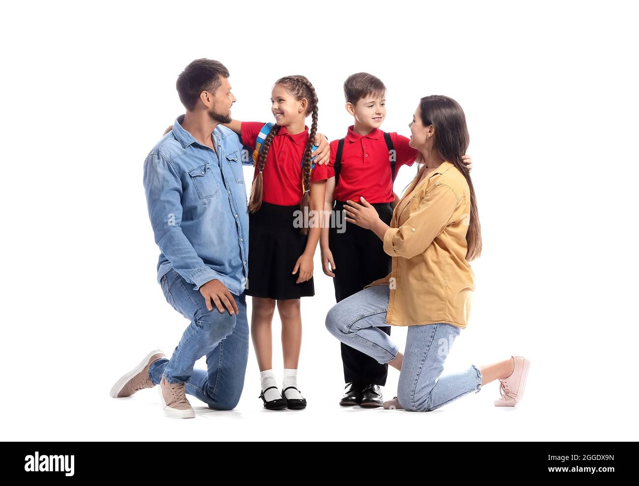 Little schoolchildren with their parents on white background Stock ...