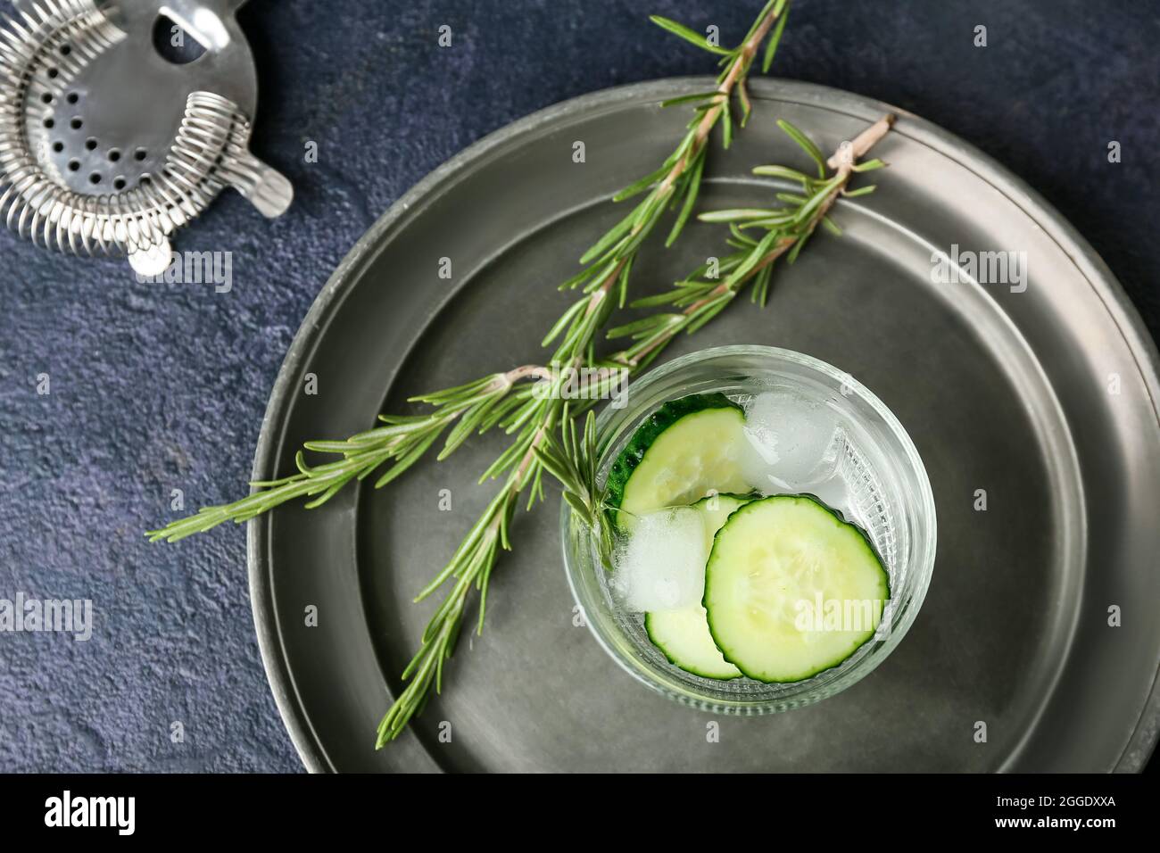 Glass of cold gin tonic and cucumber slices on dark background Stock ...