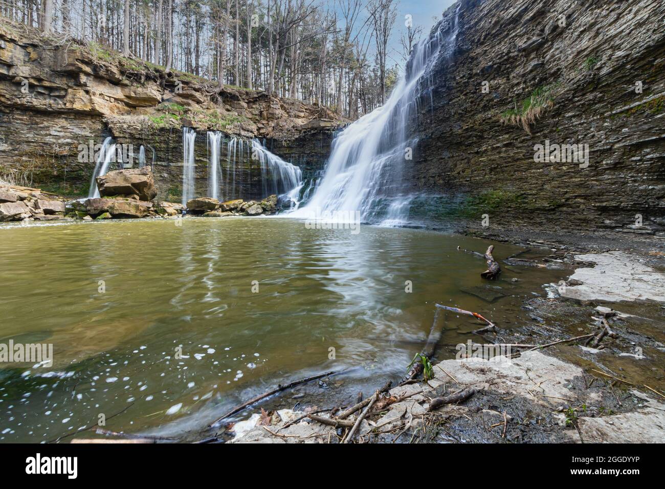 Beautiful waterfalls from rocky cliff down to a stream Stock Photo - Alamy