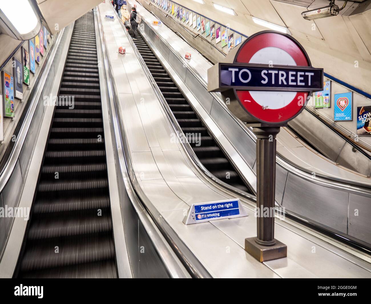 London Underground escalator. Original retro signage to the street ...