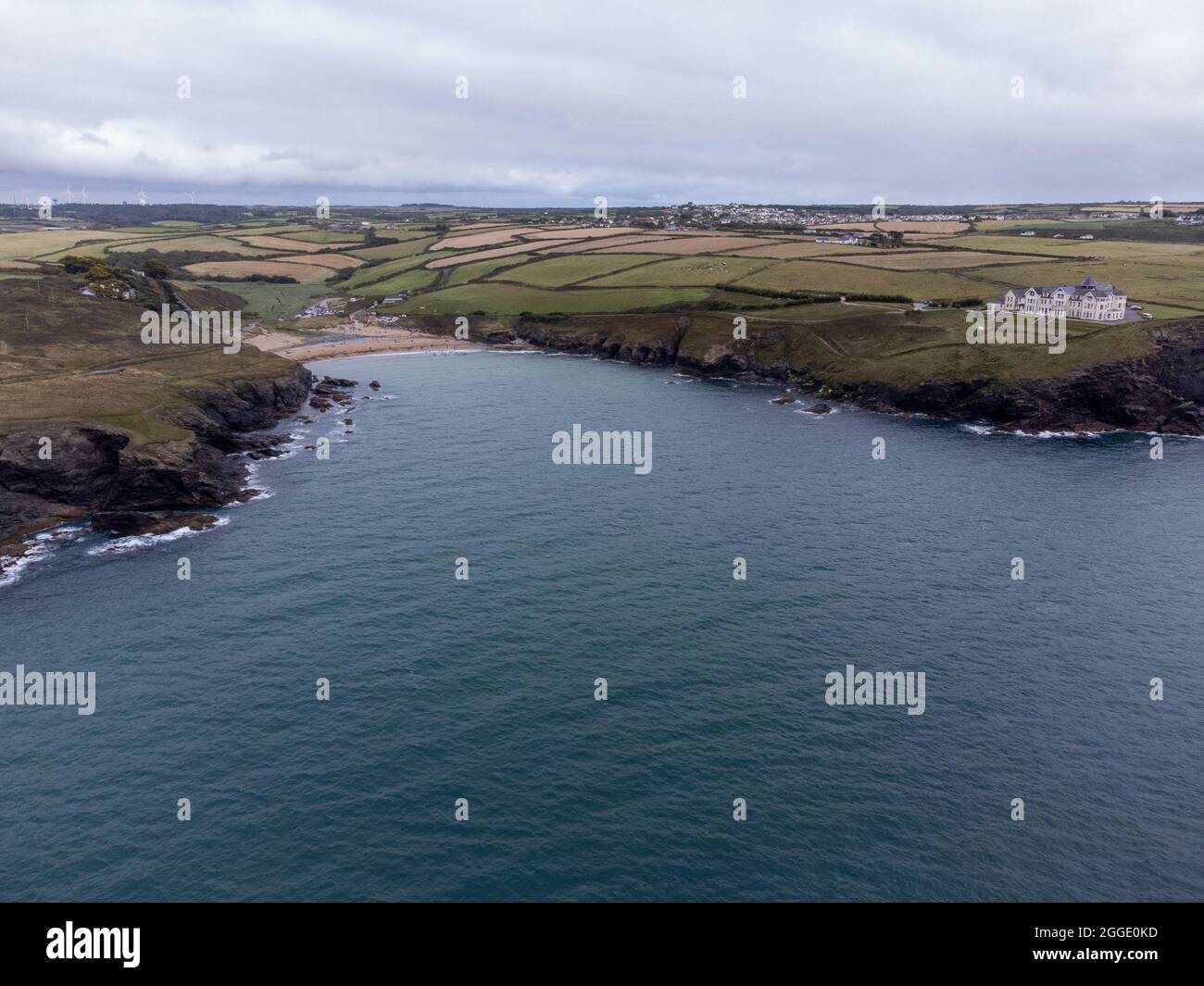 aerial drone around church cove and mullion golf course cornwall uk ...