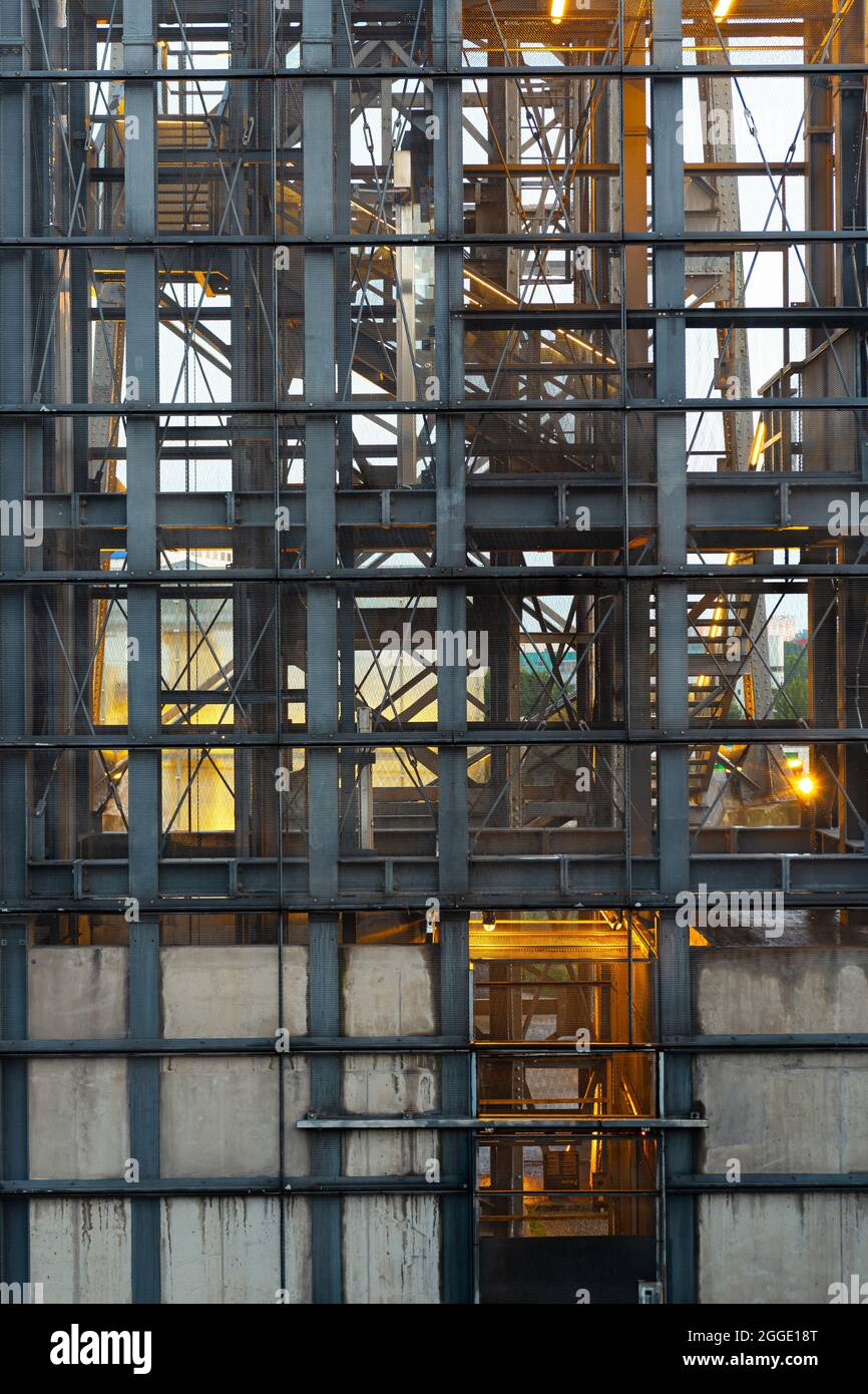 The mining shaft staircase is enclosed with a perforated steel wall ...