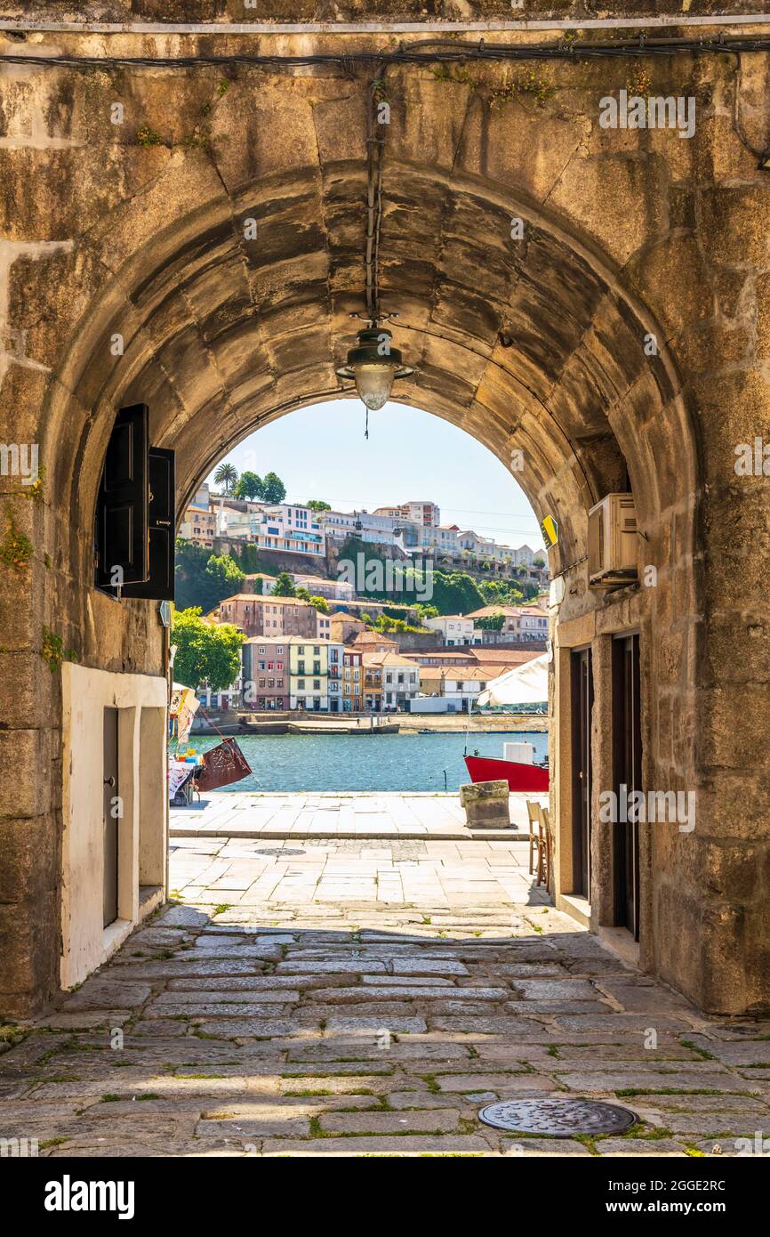 Historic gate to medieval city of Porto with view on Vila Nova de Gaia ...