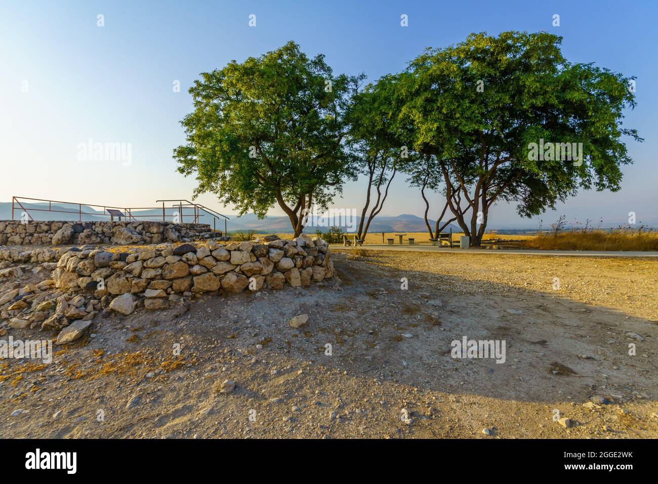 View of ancient Israelite buildings remains, with trees and landscape ...