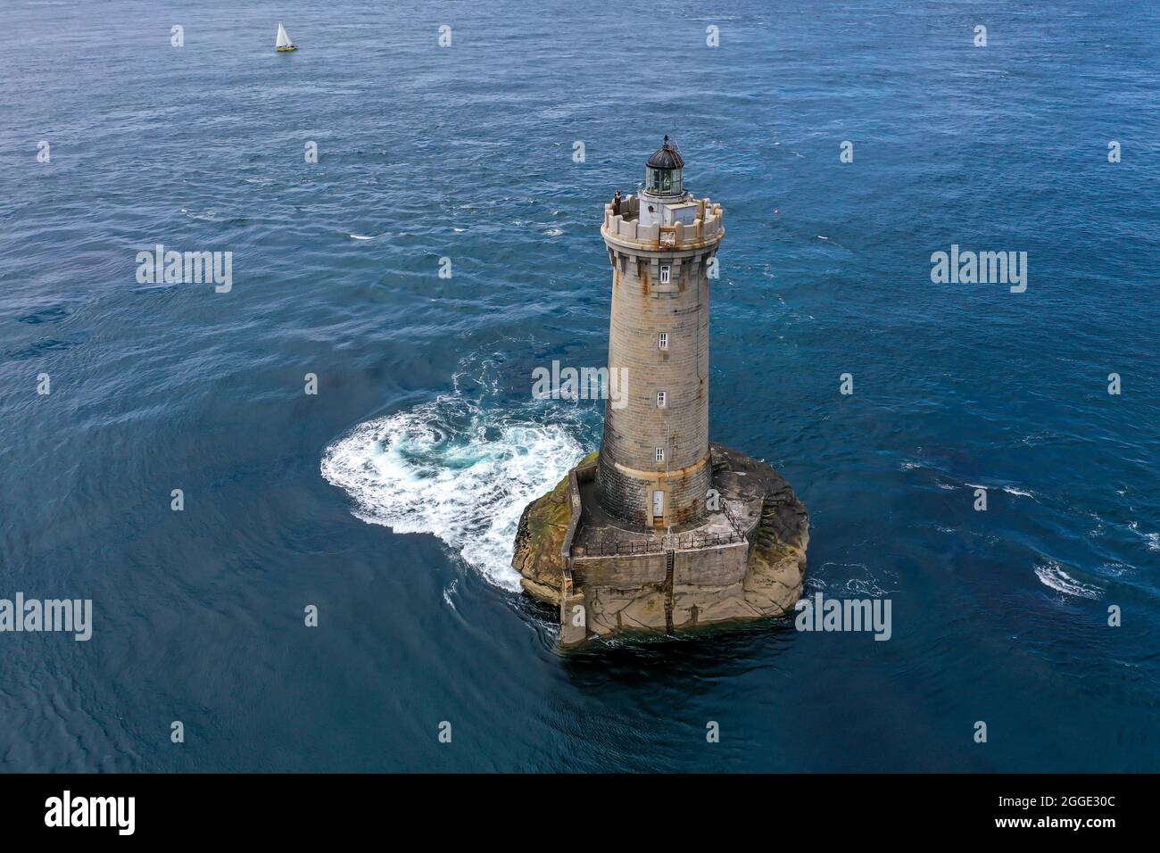 Drone image of the Phare du Four lighthouse in the middle of the ...