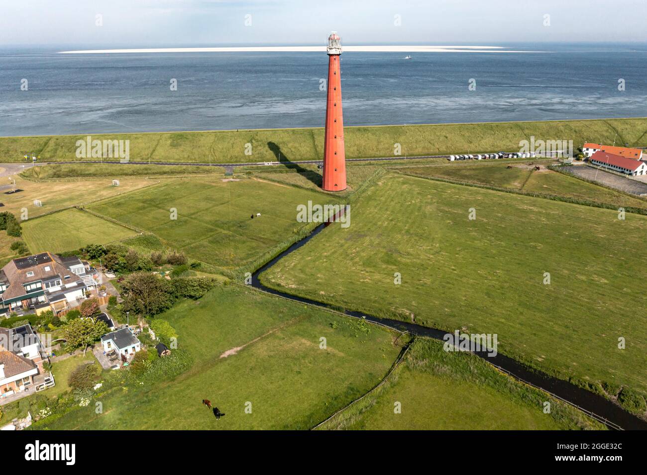 Drone shot of the lighthouse Huisduinen, called the long Jaap with the ...