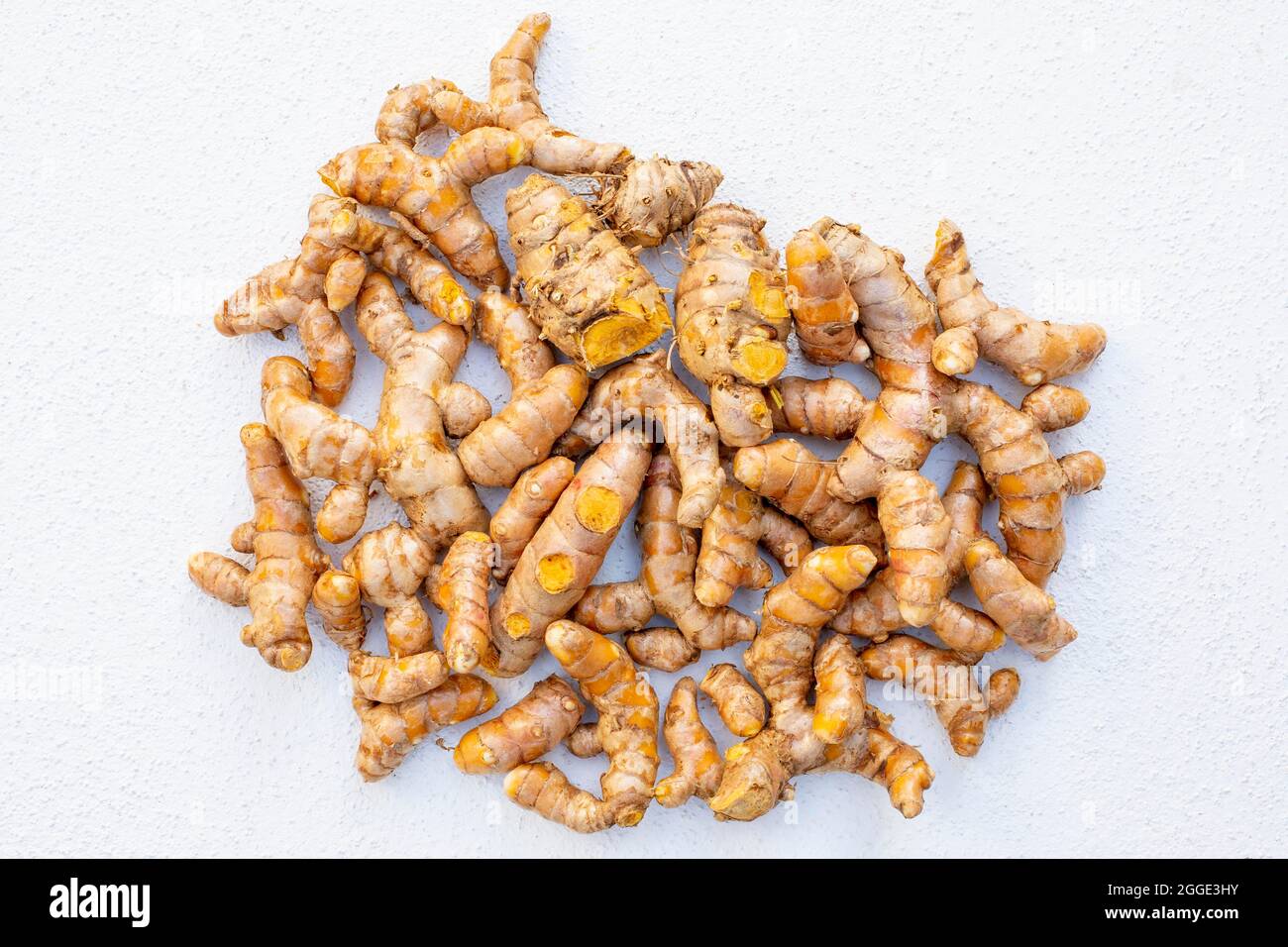 Close up of fresh turmeric (curcuma longa) roots isolated on white ...