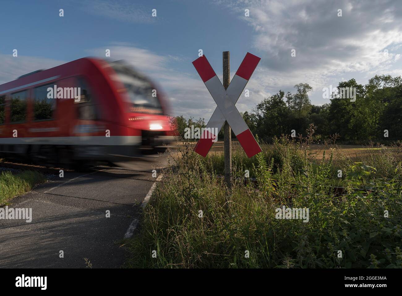 Unguarded level crossing with approaching train, Schnaittach, Middle ...