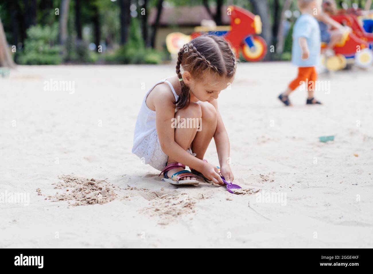 Little Girl Playing Sandbox Playground Digging Sand Shovel Building ...