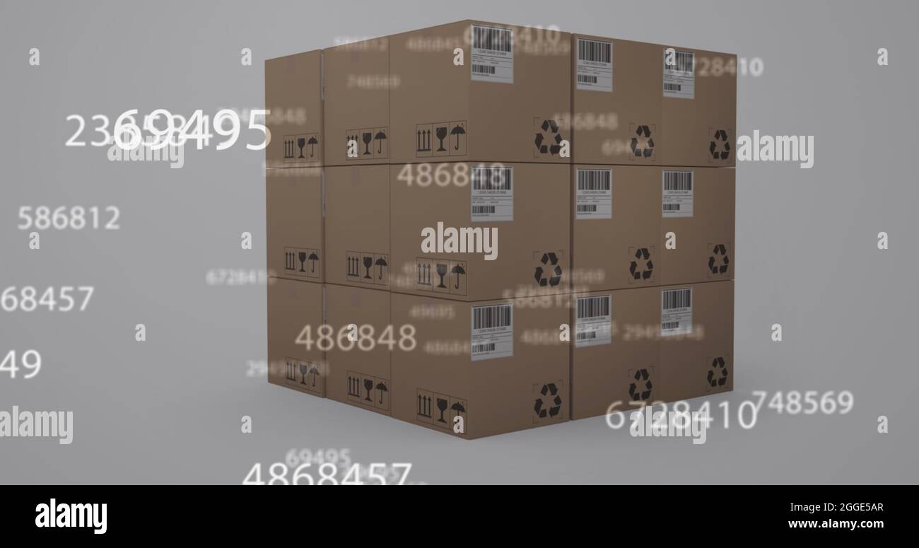 Image of numbers changing over stack of cardboard boxes in background ...