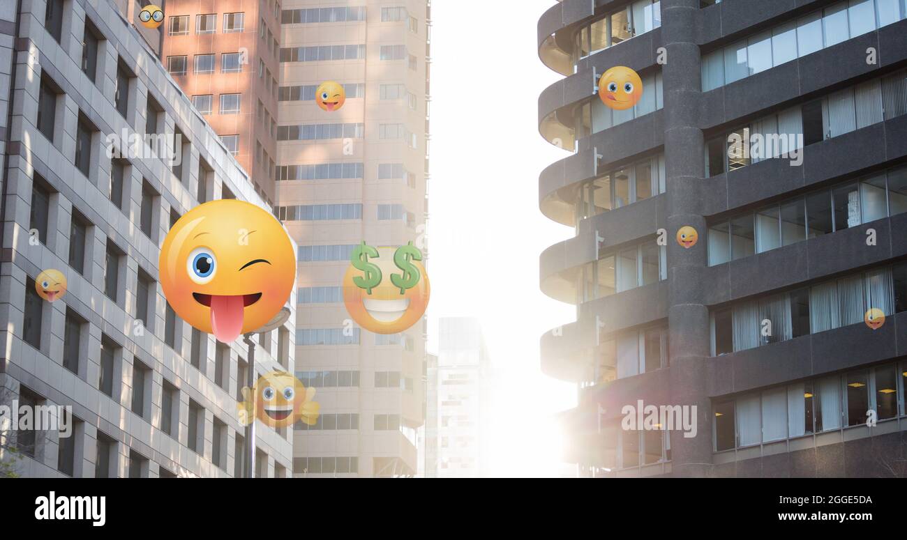 Image of emoji icons flying up over modern office buildings Stock Photo ...