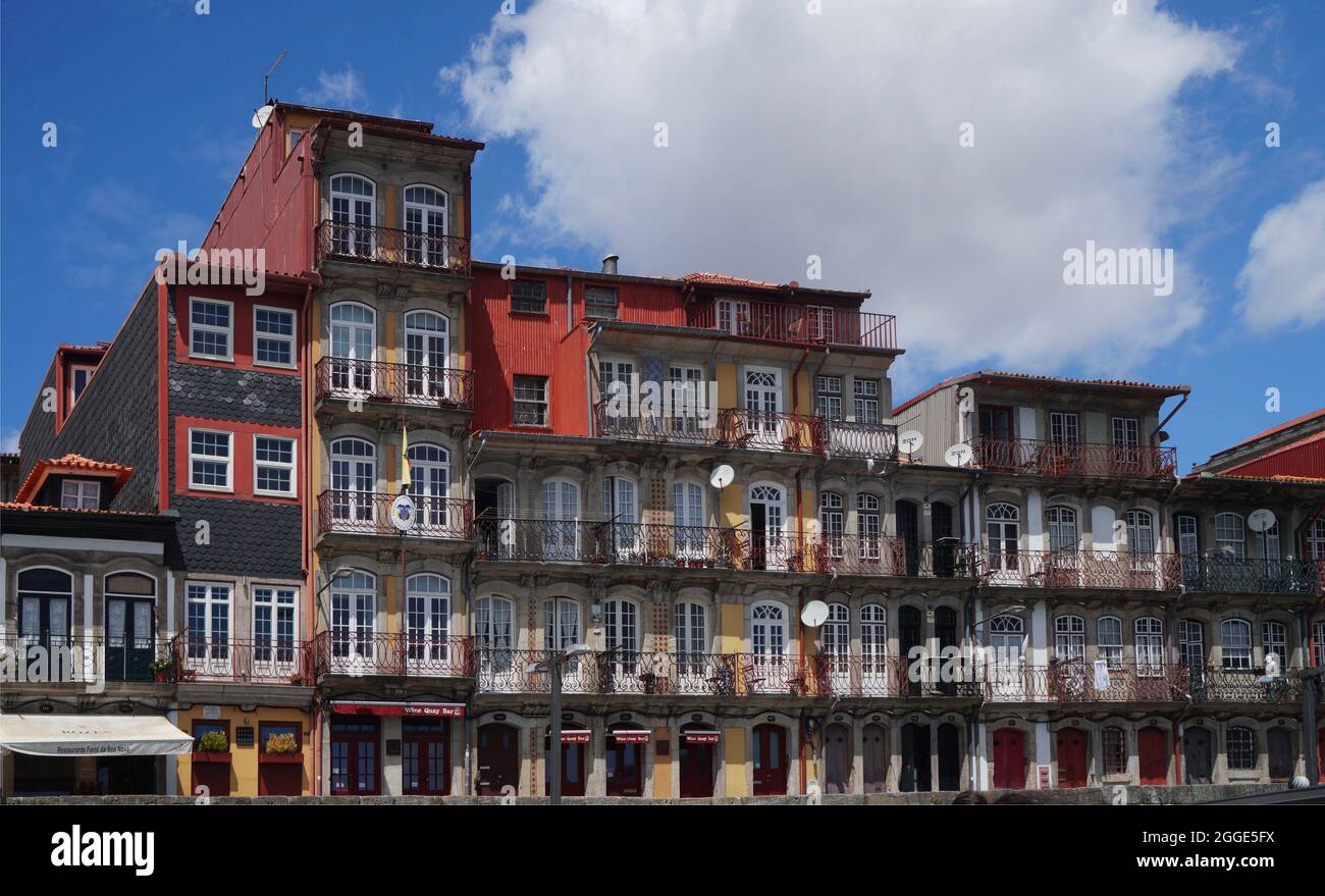 a huge old traditional poor colorful, building with many apartments and ...