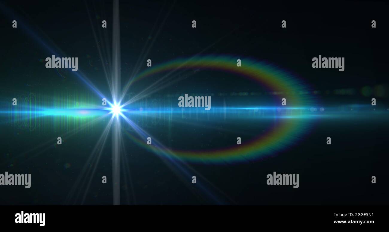 Spot of light and lens flare against black background Stock Photo - Alamy