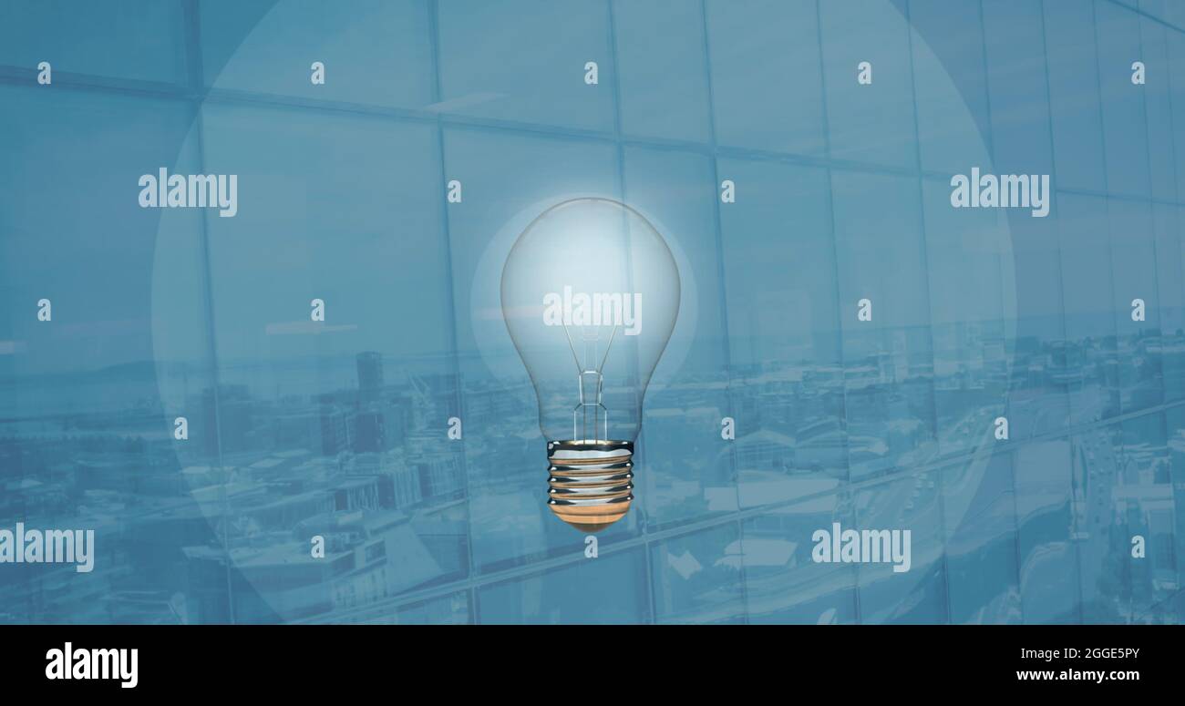 Image of light bulb over office on blue background Stock Photo - Alamy
