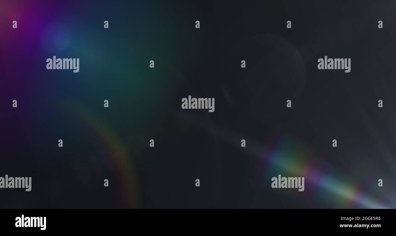 Spot of light and lens flare against black background Stock Photo - Alamy