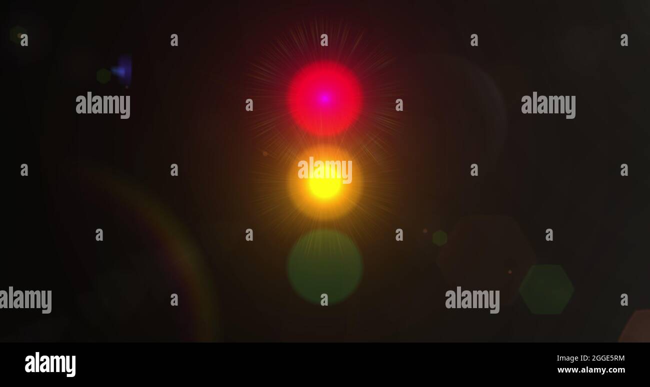 Glowing spots of light against black background Stock Photo - Alamy
