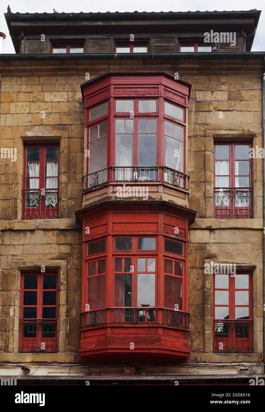 Traditional red balcony in Arabic style in a neoclassical building ...