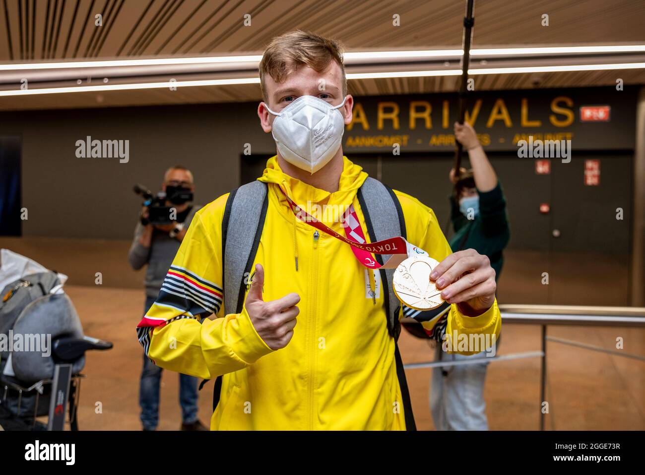 Belgian table tennis player Laurens Devos and his medal pictured at the ...