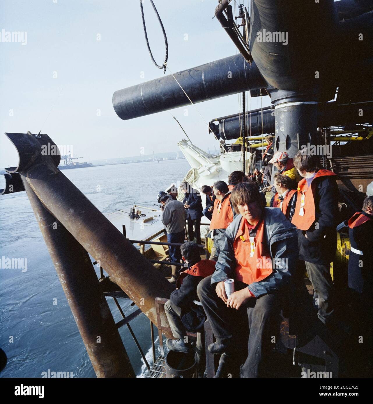 A group of people in life jackets on the oil platform Graythorp II ...