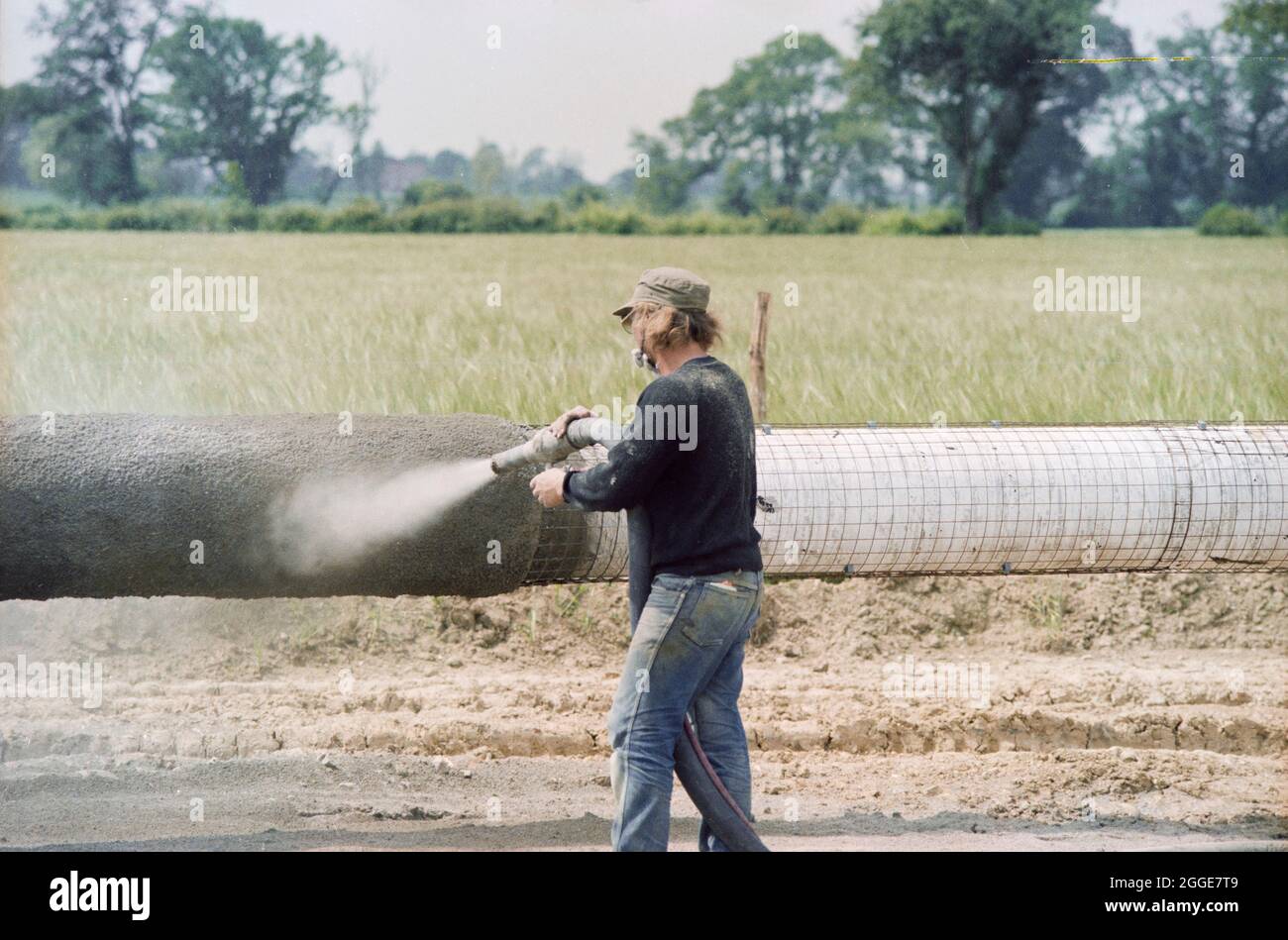 A worker carrying out guniting (spraying concrete) on the Southern gas ...