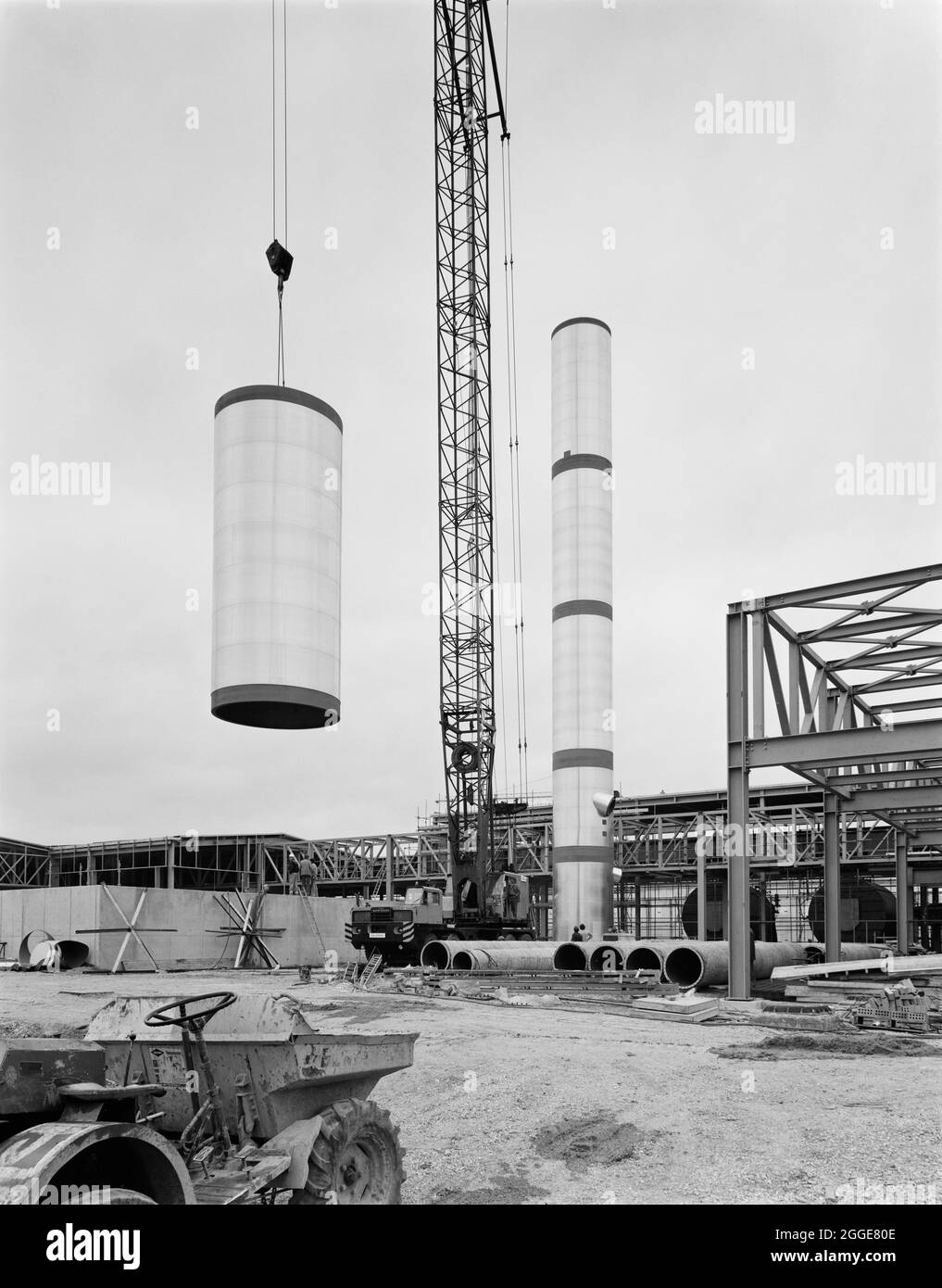 A section of the 200ft tall chimney being raised by crane at the new ...