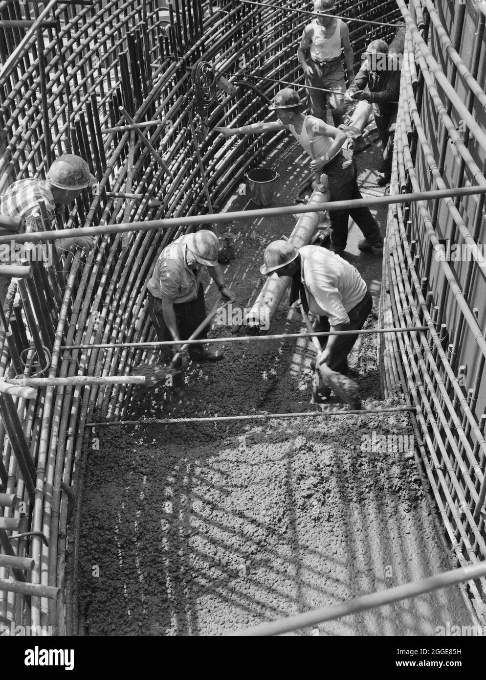 A team of workers, on lift 29 of the construction of Berkeley Nuclear ...