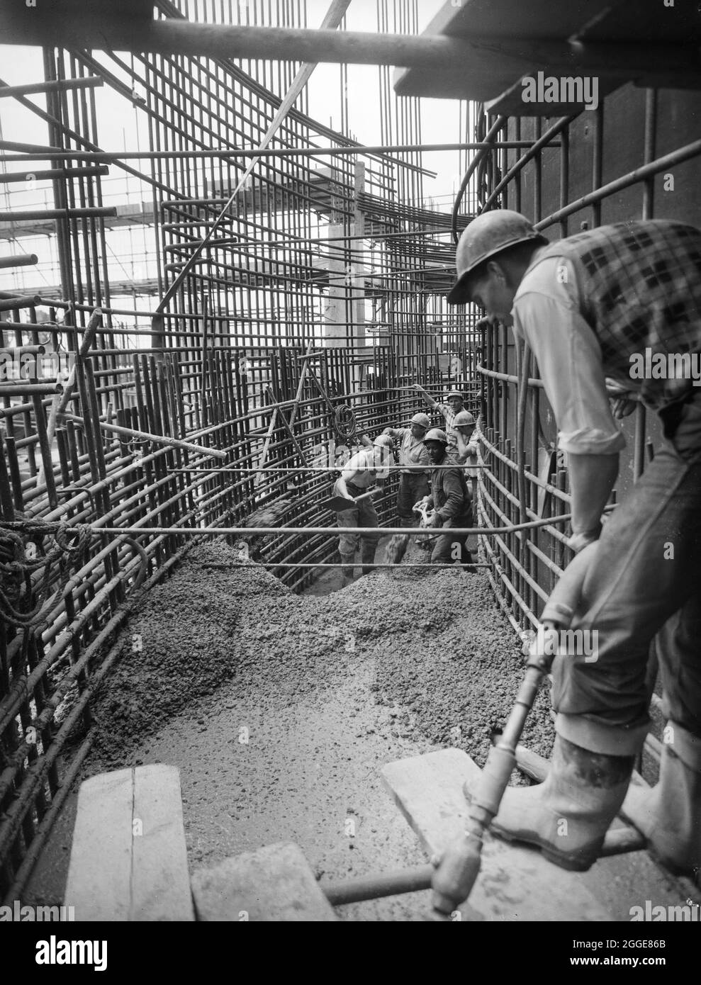 A team of workers, on lift 29 of the construction of Berkeley Nuclear ...