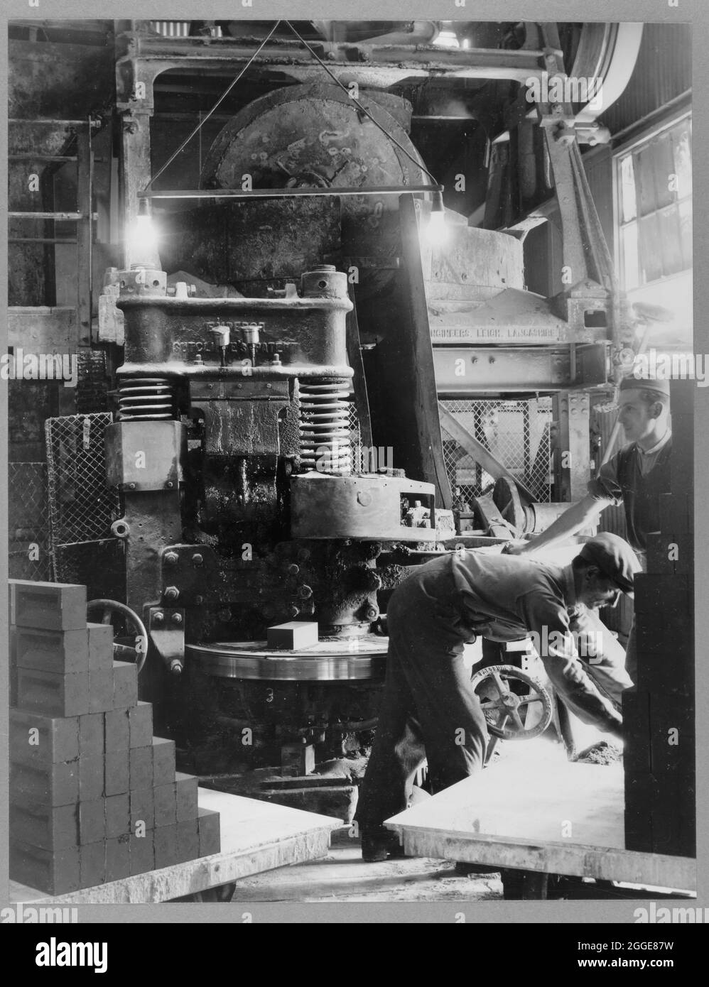 Two brickmakers at work in the Brisco Brickworks. The Brisco Brickworks ...