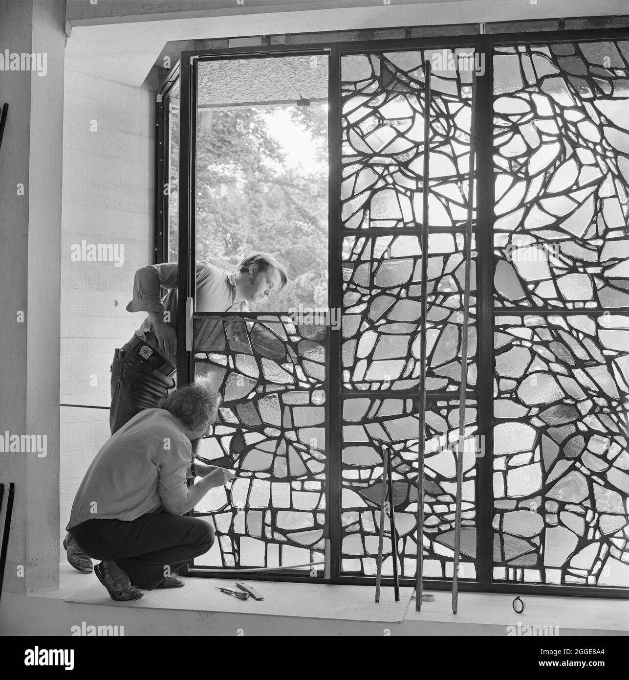 Artist Henry Haig and his assistant, installing one of the stained ...