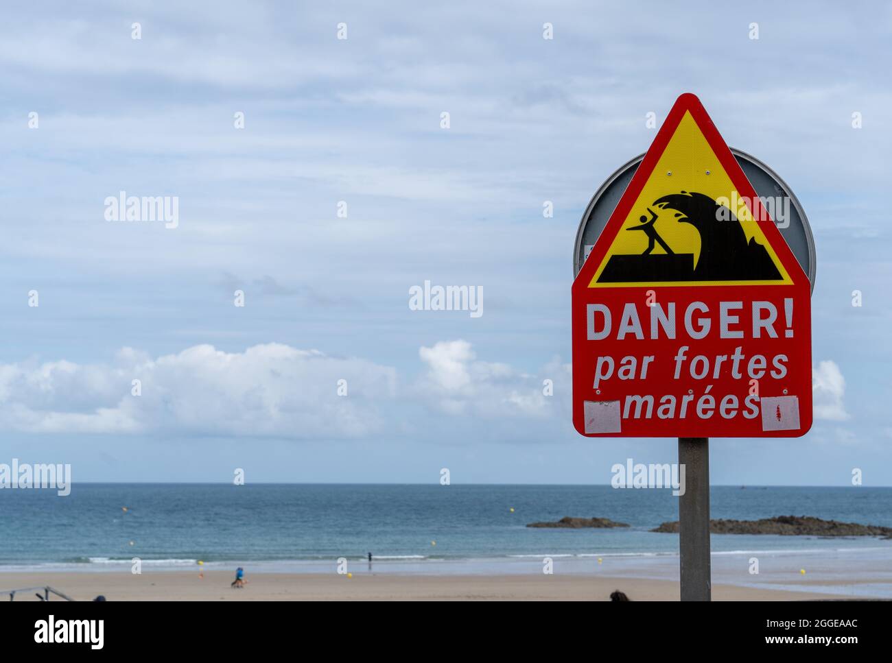 Warning sign against surf and big waves on the beach of Saint-Malo ...