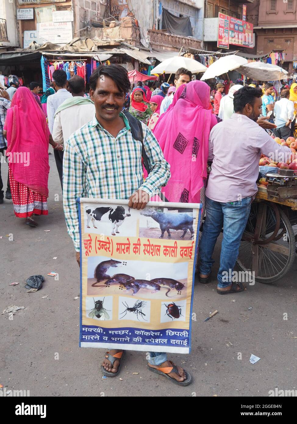 Street vendor presenting a poster, Sardar Market, Old City, Jodhpur ...