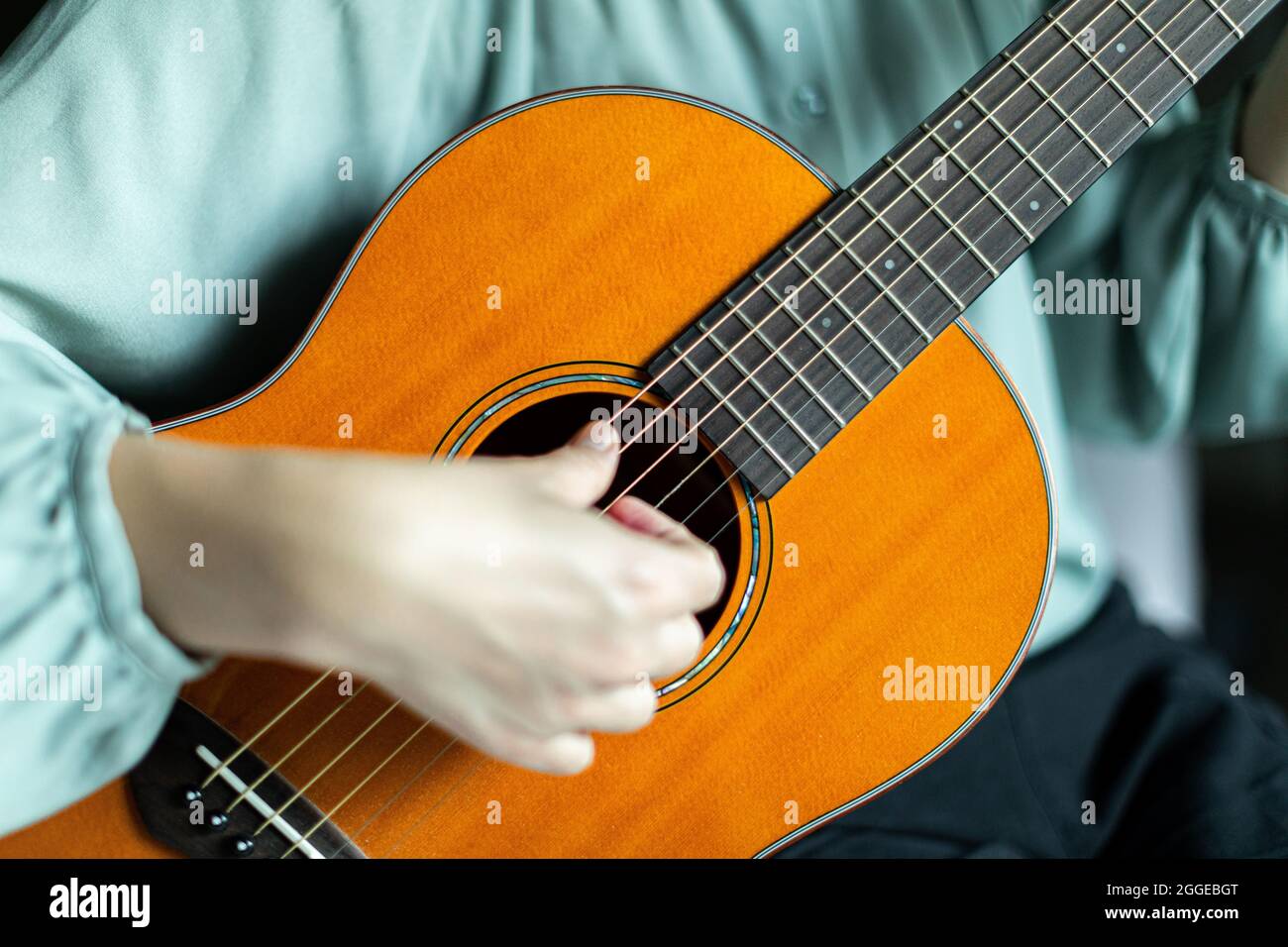 Lady guitar cord hi-res stock photography and images - Alamy