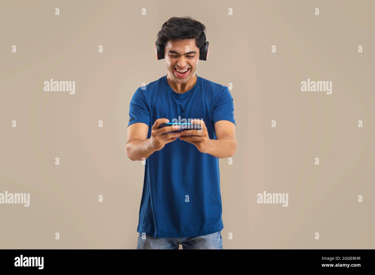 Boy playing game on mobile hi-res stock photography and images - Alamy