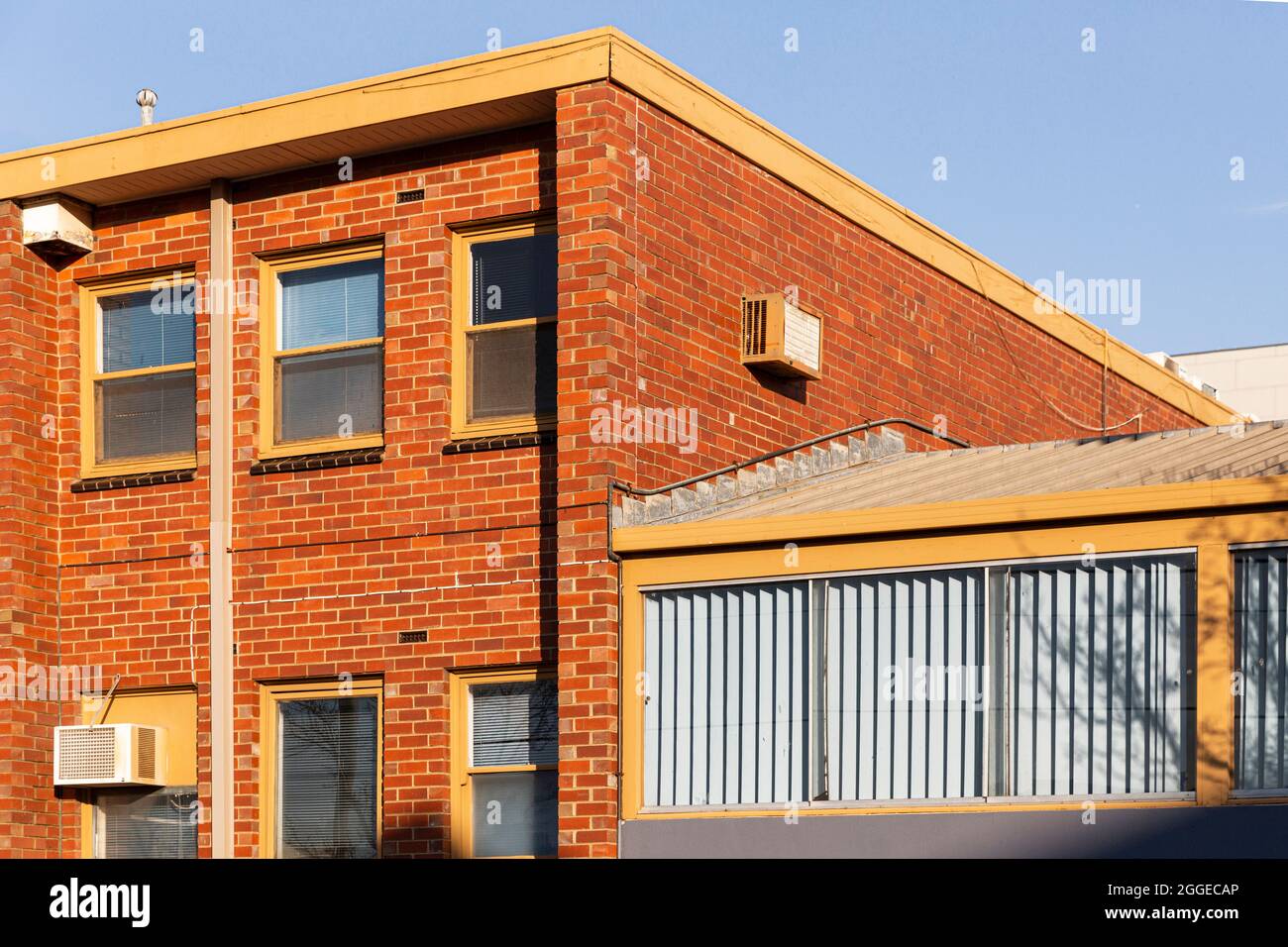 Exterior of brick building with extension Stock Photo - Alamy