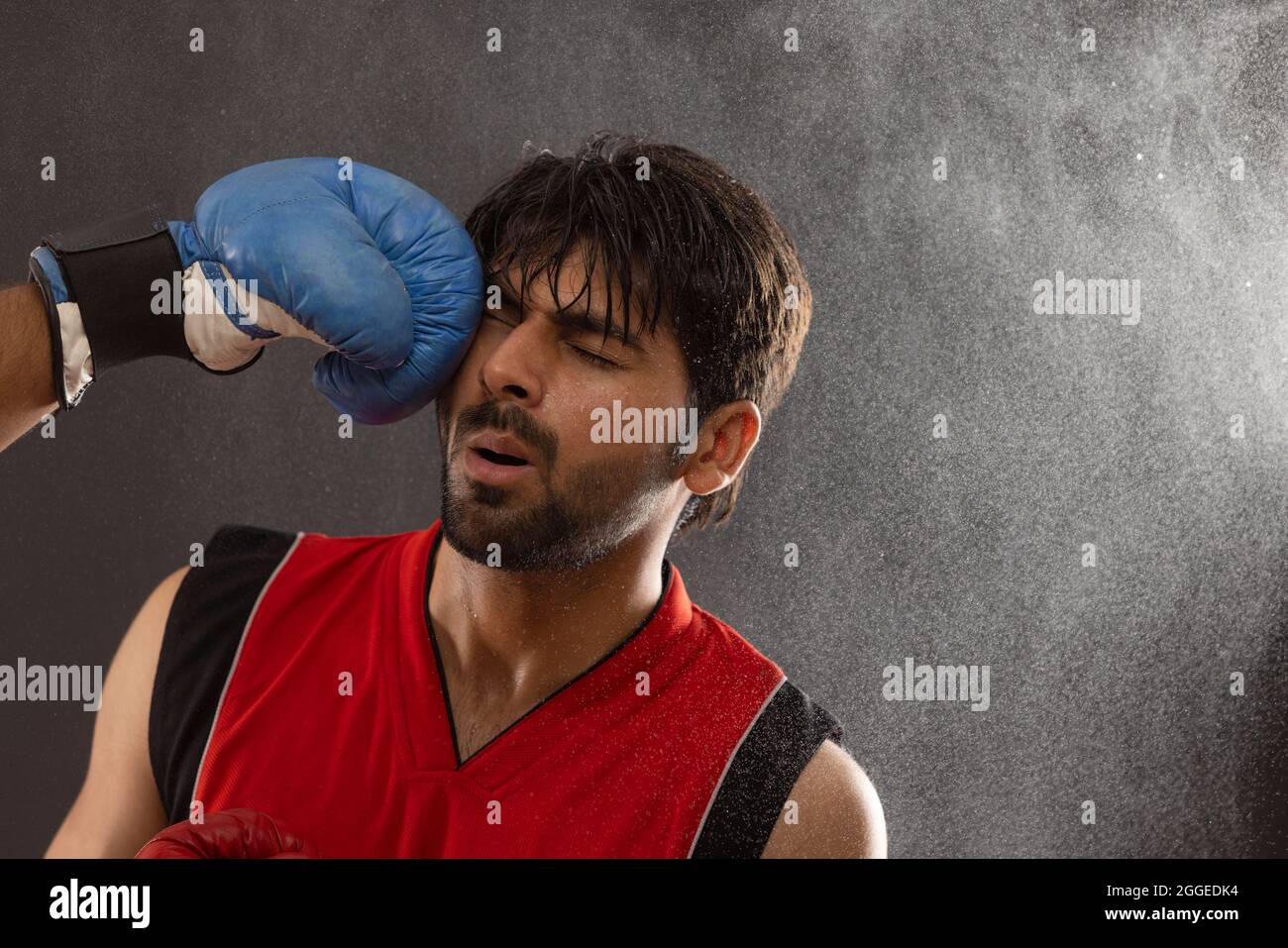 A BOXER PUNCHED DURING BOXING PRACTICE Stock Photo - Alamy