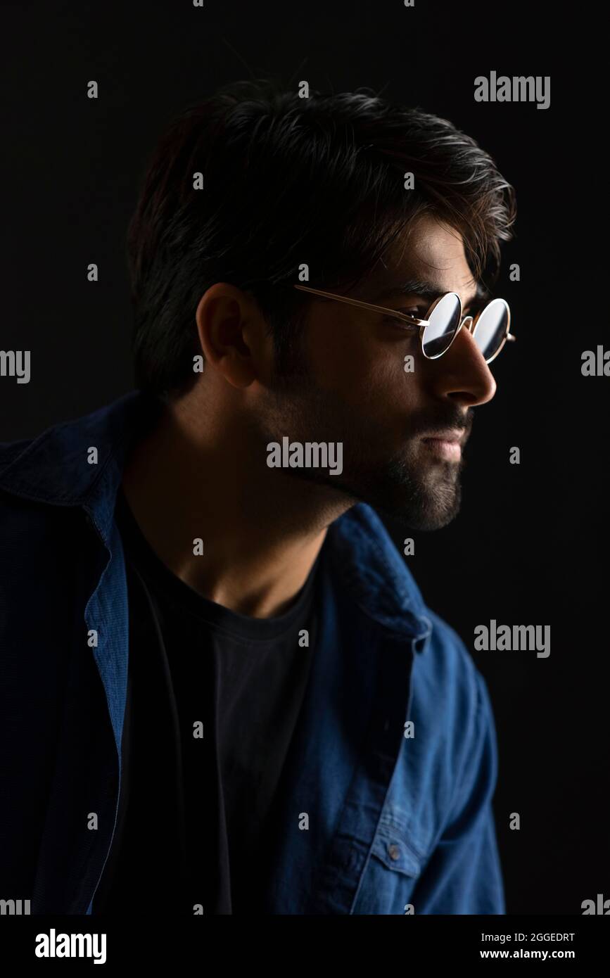 PORTRAIT OF A STYLISH YOUNG MAN POSING Stock Photo - Alamy