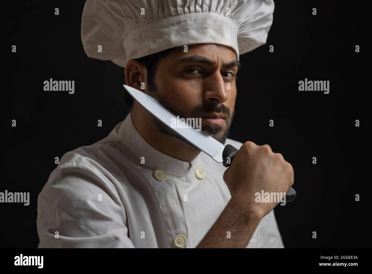 A PROFESSIONAL CHEF SITTING AND POSING IN FRONT OF CAMERA Stock Photo ... A PROFESSIONAL CHEF SITTING AND POSING IN FRONT OF CAMERA Stock Photo ...