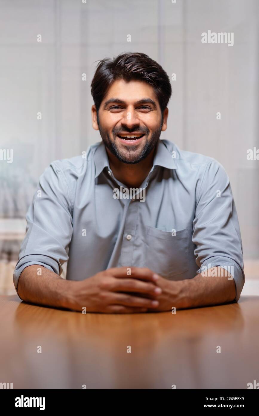 Smart professional sitting laughing hi-res stock photography and images ...