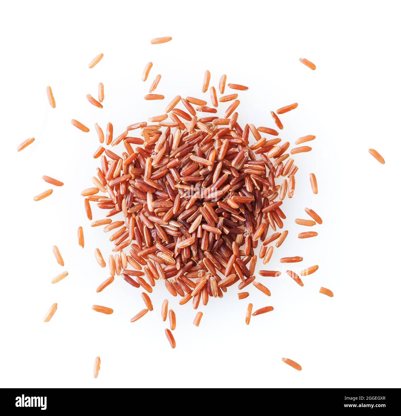 Heap of uncooked red rice isolated on white background Stock Photo - Alamy